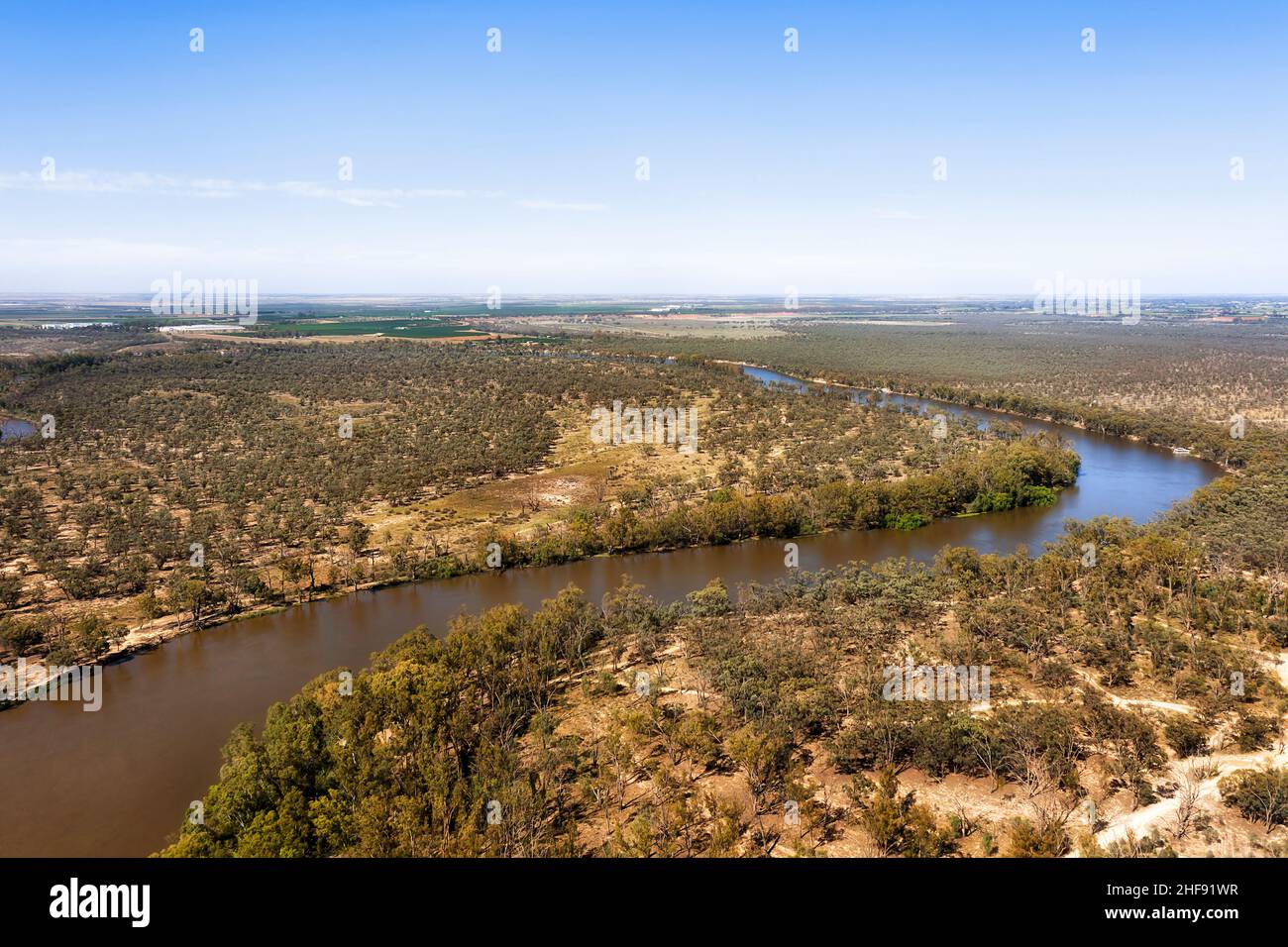 Aerial landscape view of Murray river plains with turns high over woods ...