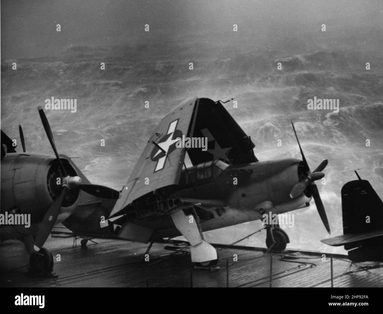SB2C Helldiver on USS Kwajalein (CVE-98) in a typhoon 1944 Stock Photo ...