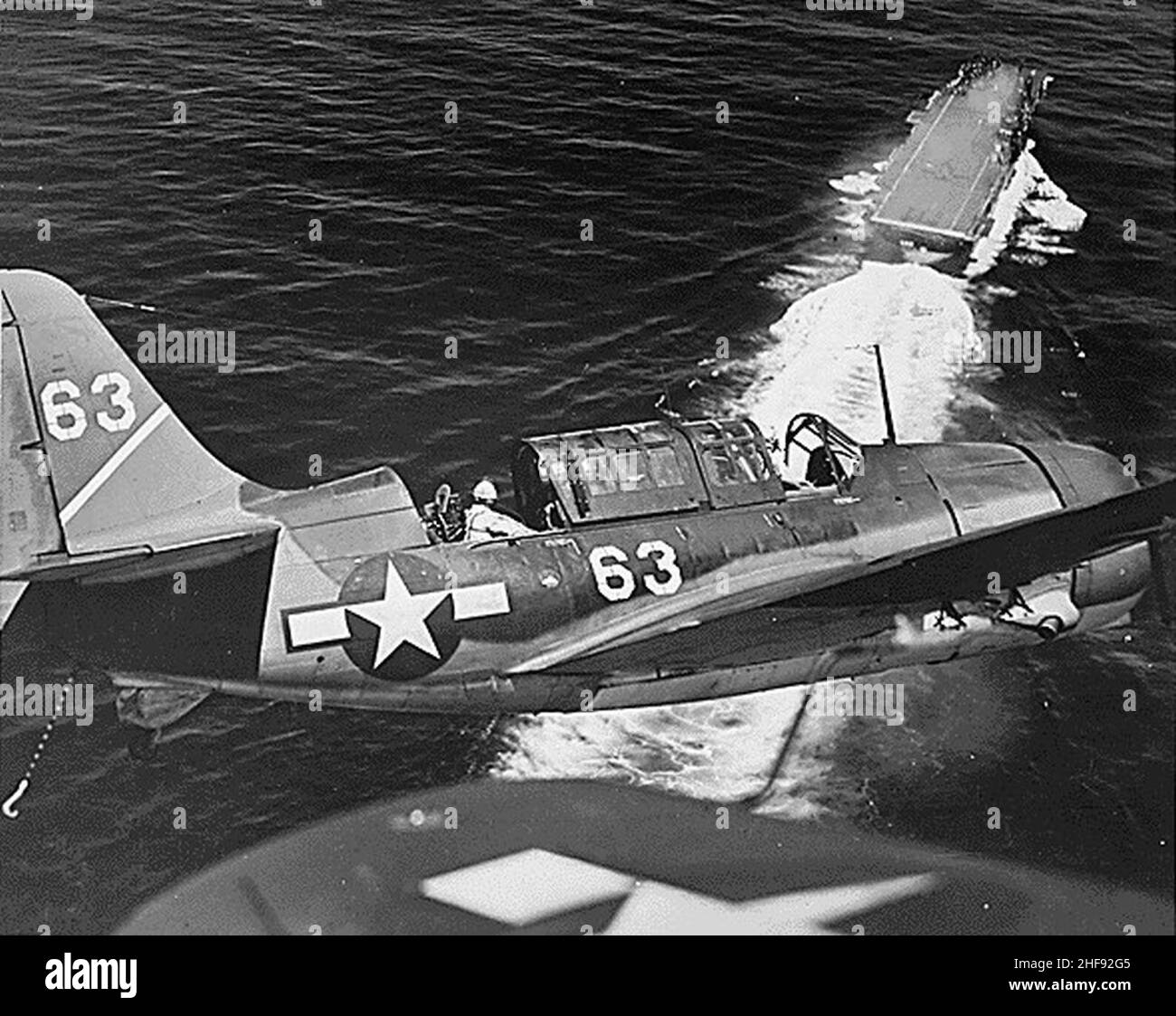 SB2C-1C Helldivers of VB-1 fly over USS Yorktown (CV-10) in July 1944 ...