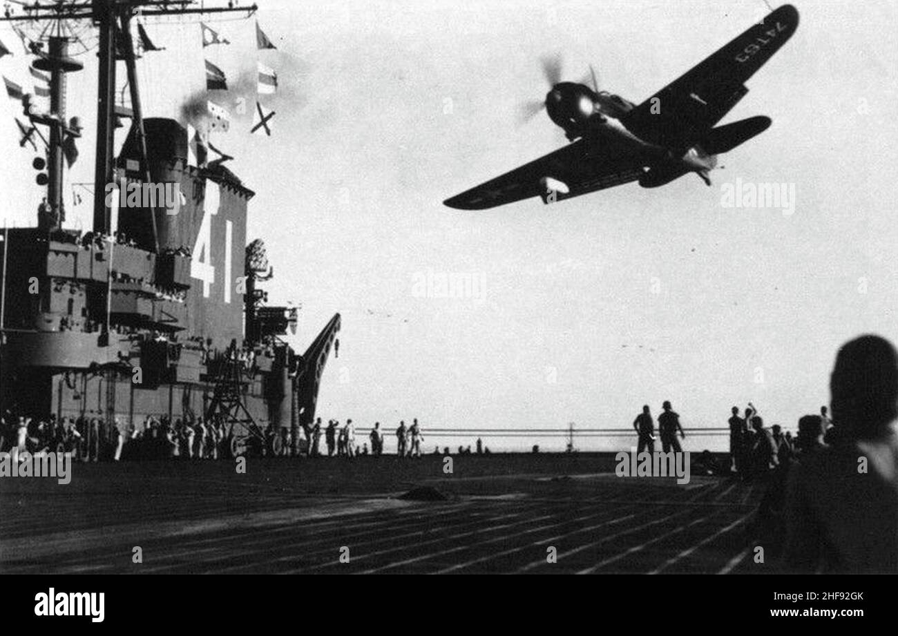 SB2C-4E Helldiver of VT-74 flies over USS Midway (CVB-41) in 1946 Stock ...
