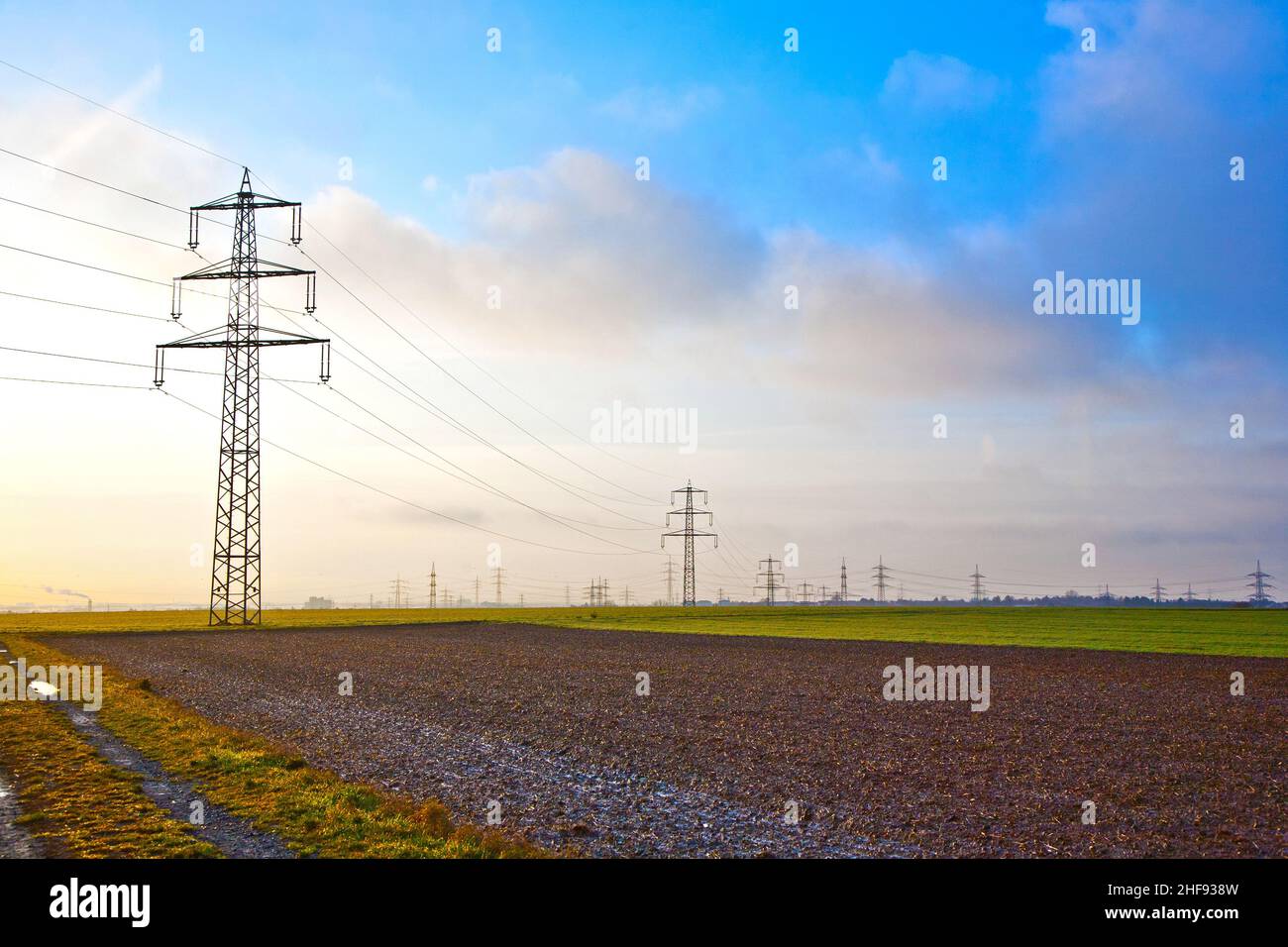 electrical tower in landscape with dark clouds Stock Photo - Alamy