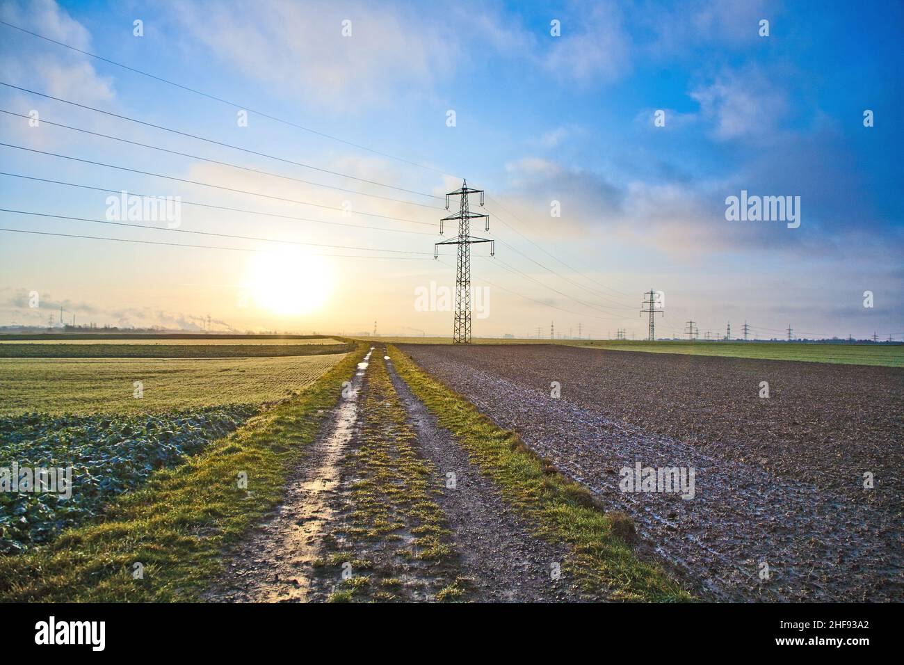 electrical tower in landscape with dark clouds Stock Photo - Alamy