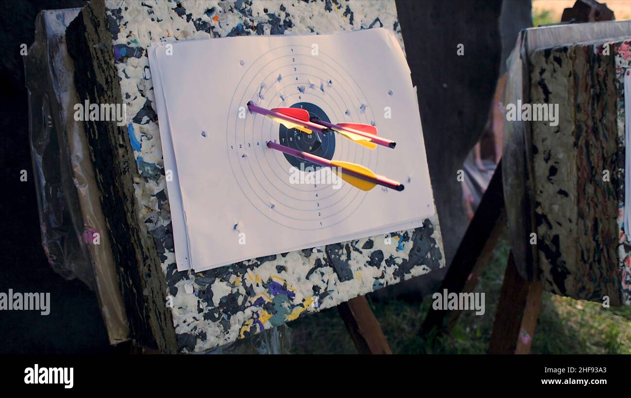 Arrow in the wooden target. Clip. Archery target. Series of straw ...