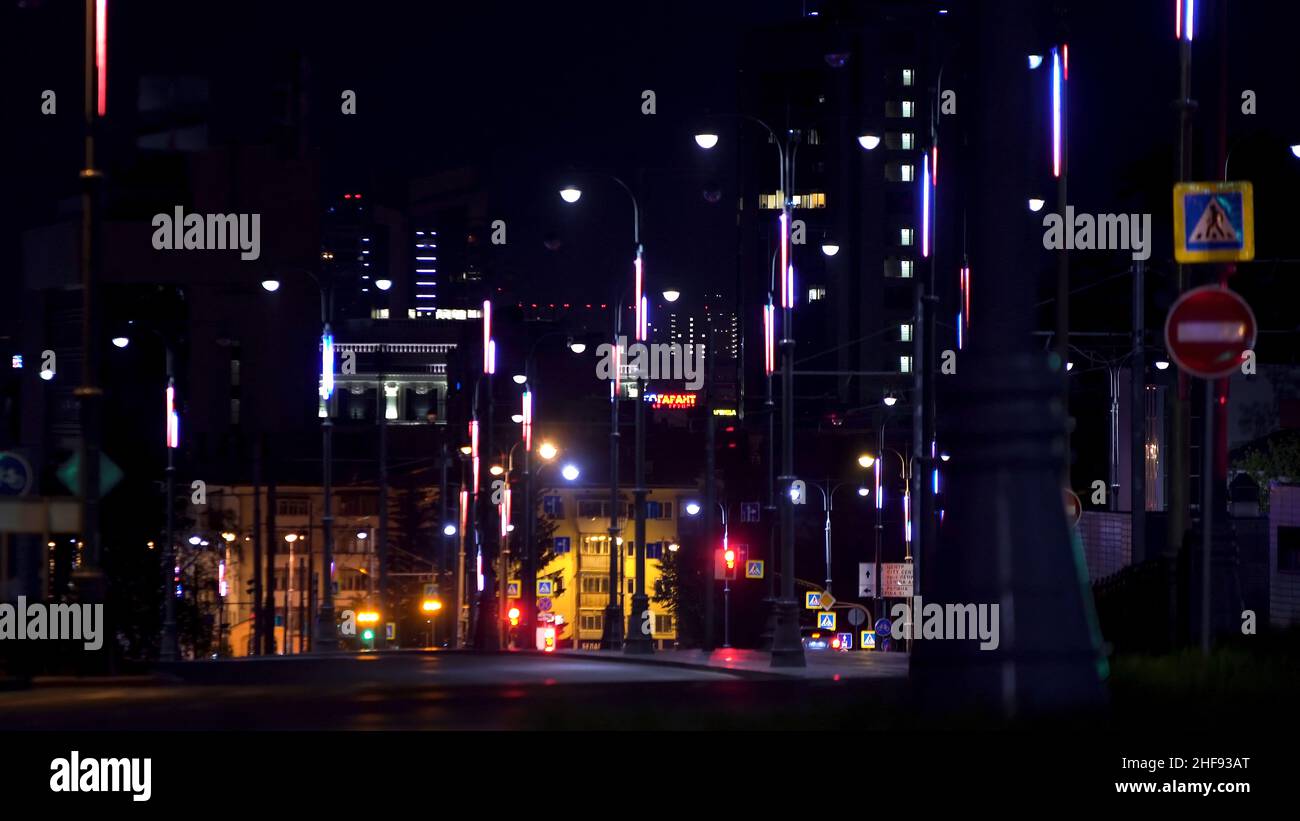 Night landscape of the big city center with shining lights and moving ...