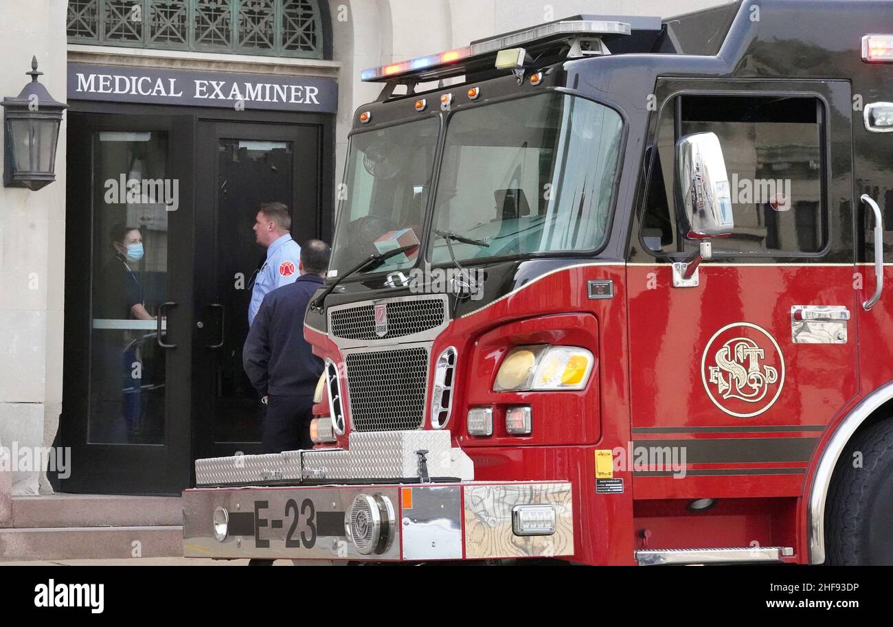 St. Louis, USA. 14th Jan, 2022. St. Louis firefighters talk with a ...
