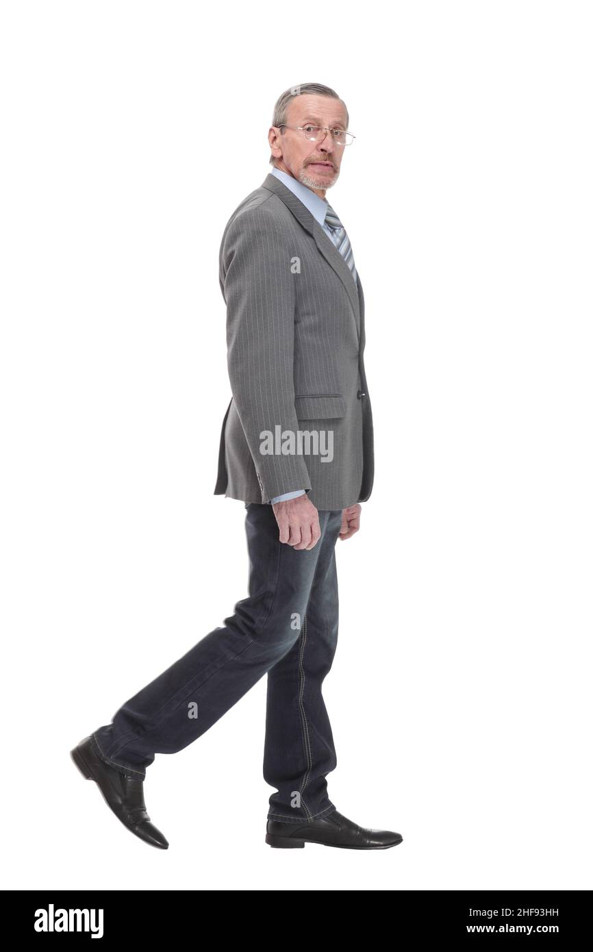 side view full length photo of a mid aged business man walking forward ...
