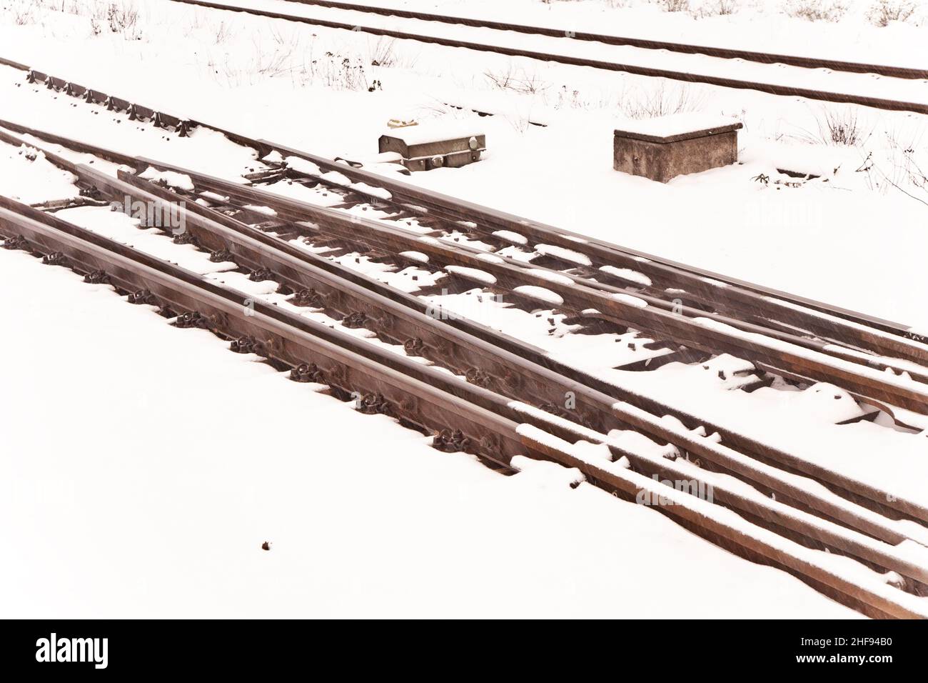 Railroad tracks in Winter with snow Stock Photo - Alamy