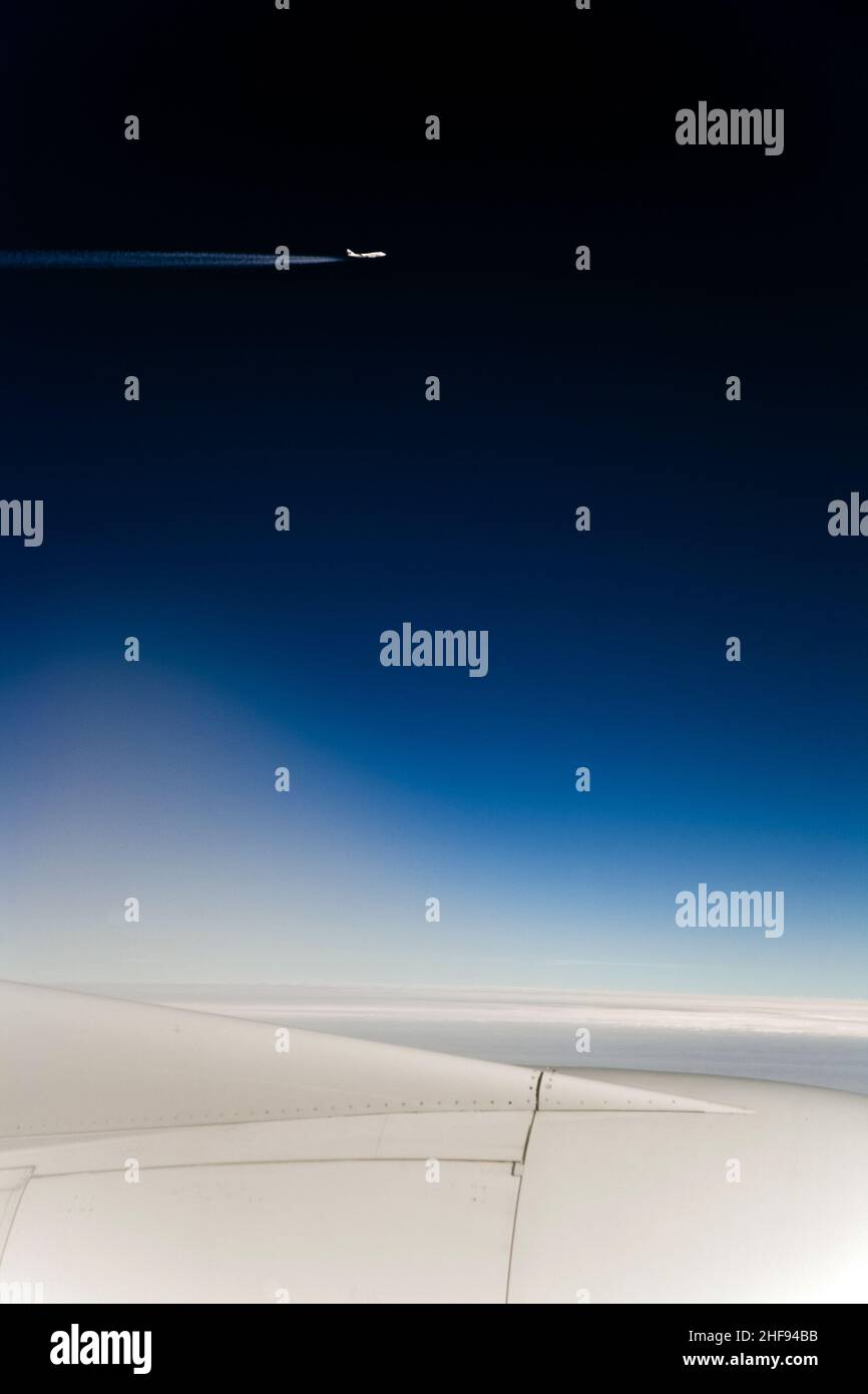 flying over the Himalaya in the morning with sunrise, a second airplane ...