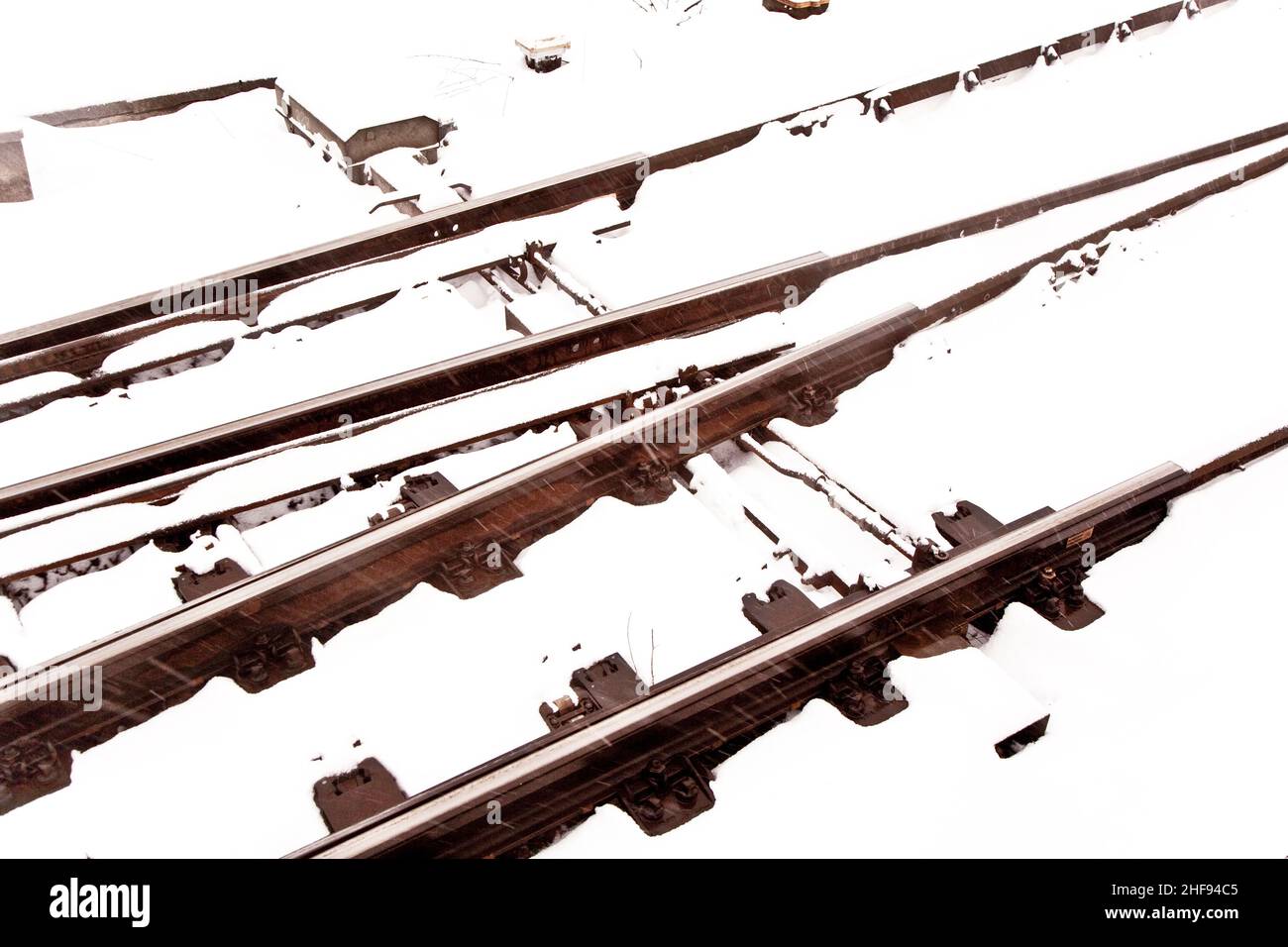 Railroad tracks in Winter with snow Stock Photo - Alamy