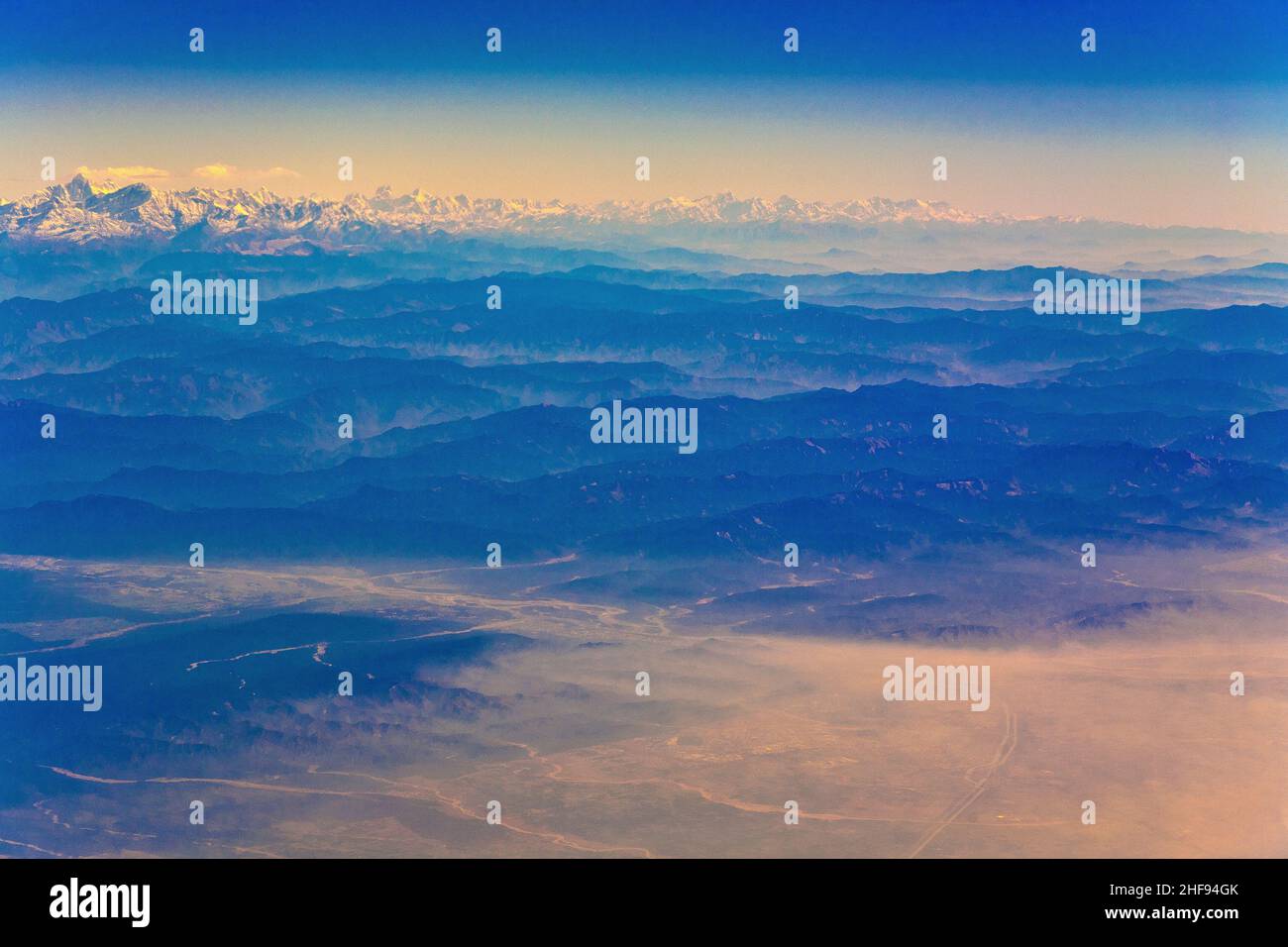 flying over the Himalaya in the morning with sunrise Stock Photo - Alamy