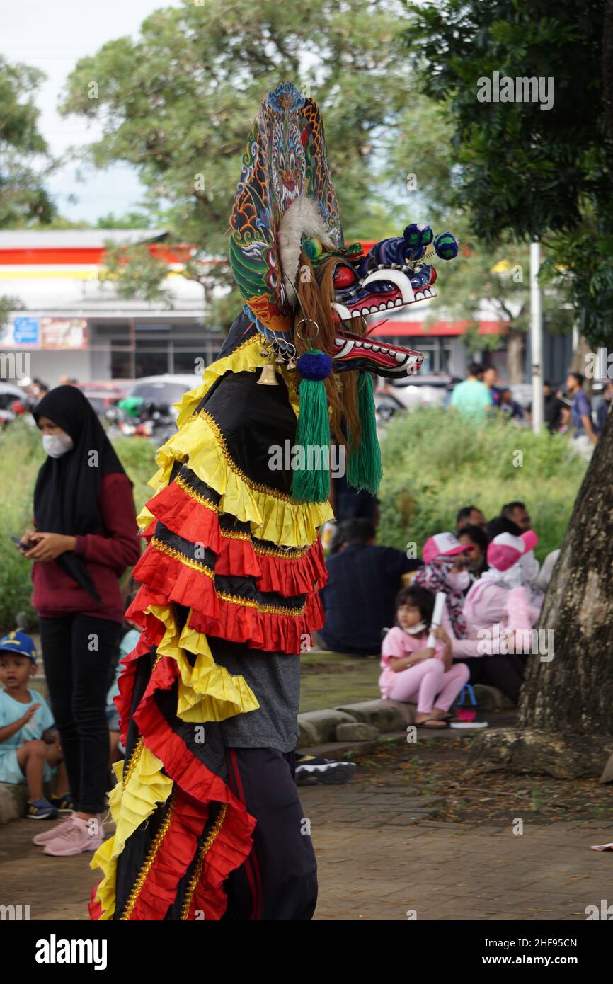 The artist performing Jaranan music dancers and playing a traditional ...