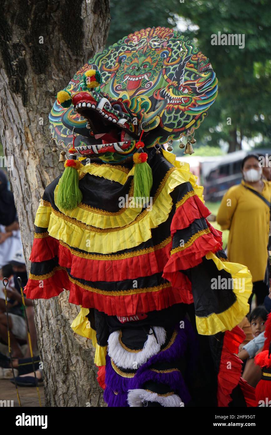 The artist performing Jaranan music dancers and playing a traditional ...