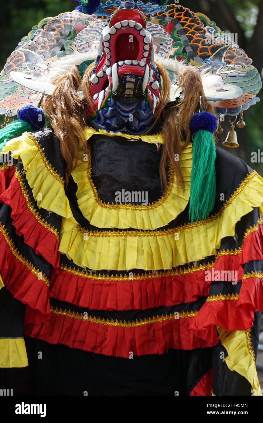 The artist performing Jaranan music dancers and playing a traditional ...