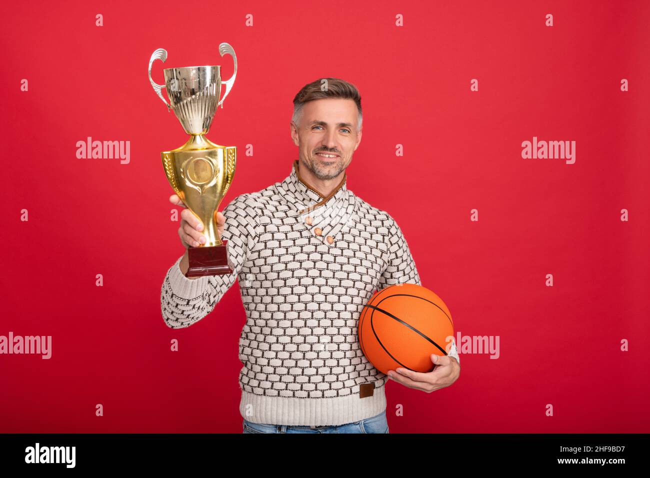 The winner is. Happy man hold basketball prize. Prize winner. Champion ...