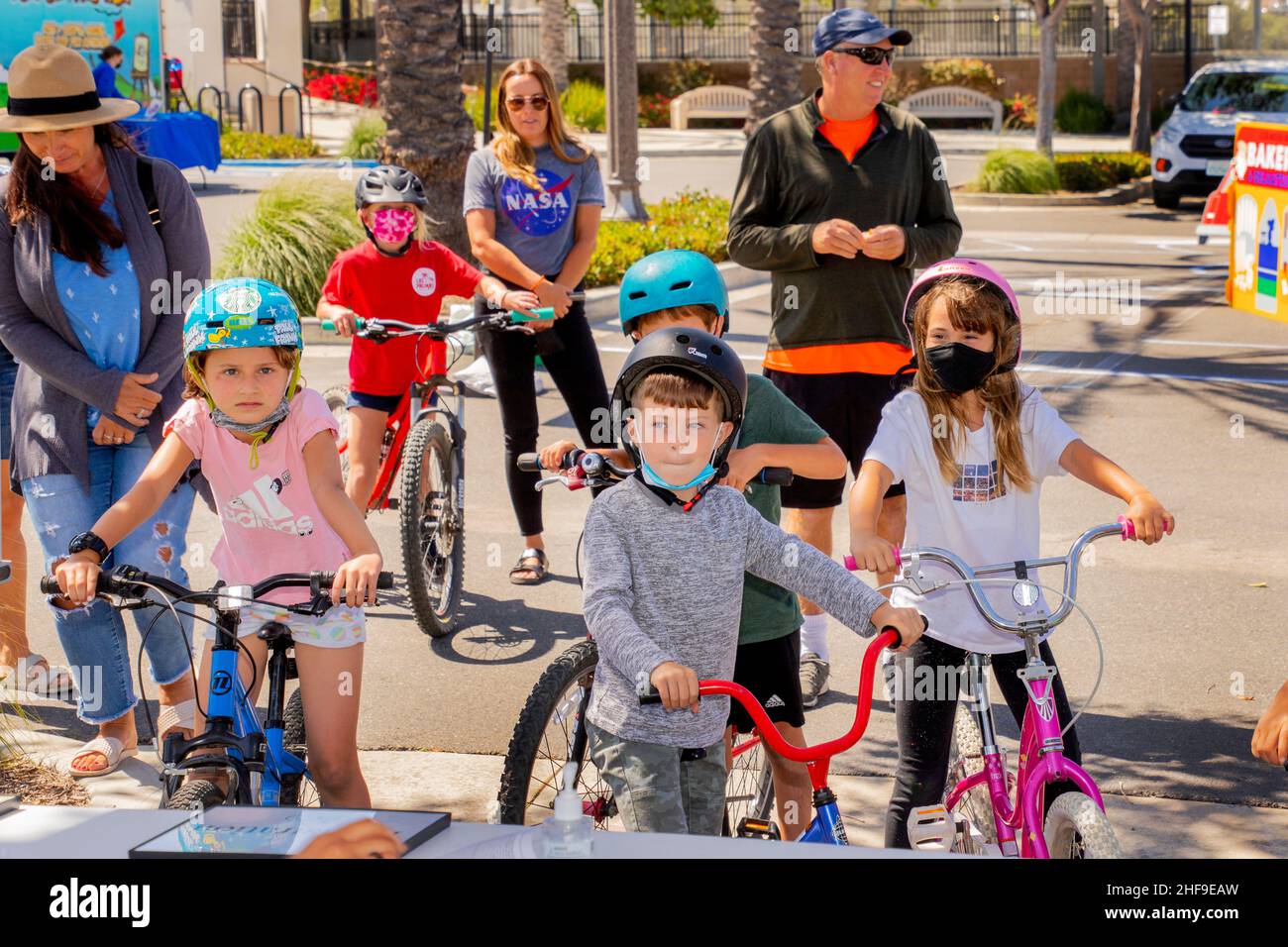 Helmet-wearing children gather in a suburban Southern California park ...