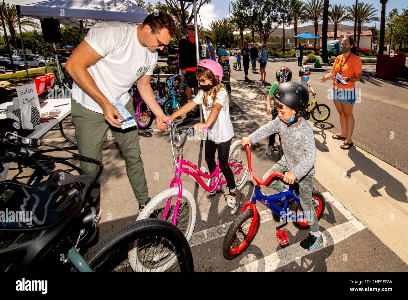 Helmet-wearing children gather in a suburban Southern California park ...