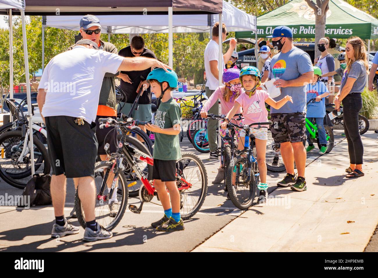 Helmet-wearing children gather in a suburban Southern California park ...