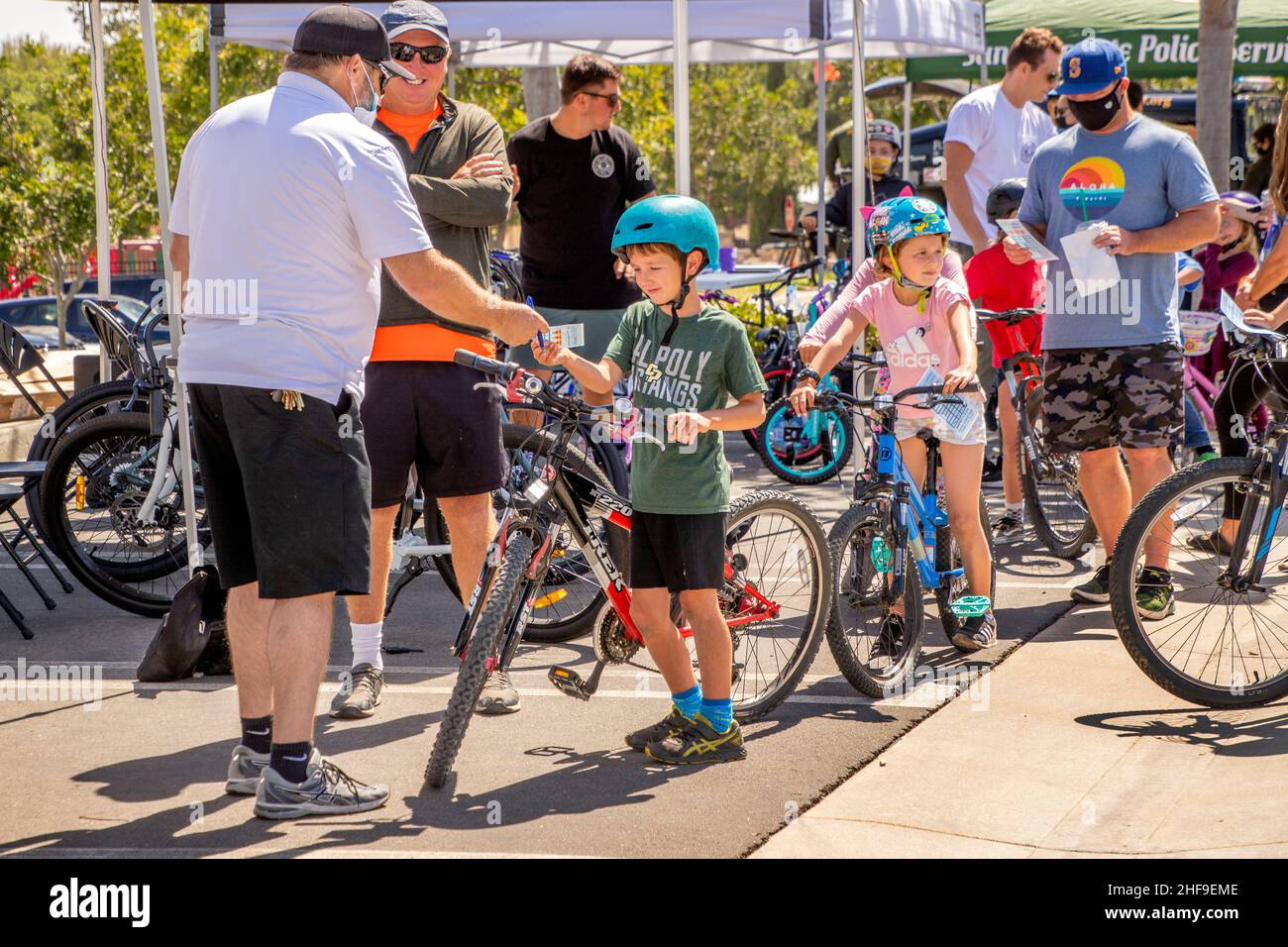 Helmet-wearing children gather in a suburban Southern California park ...