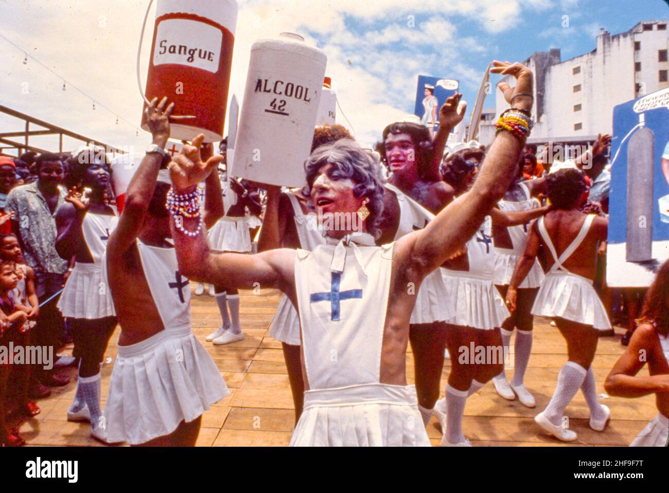 Costumed male Samba club members dressed as female nurses dance through ...