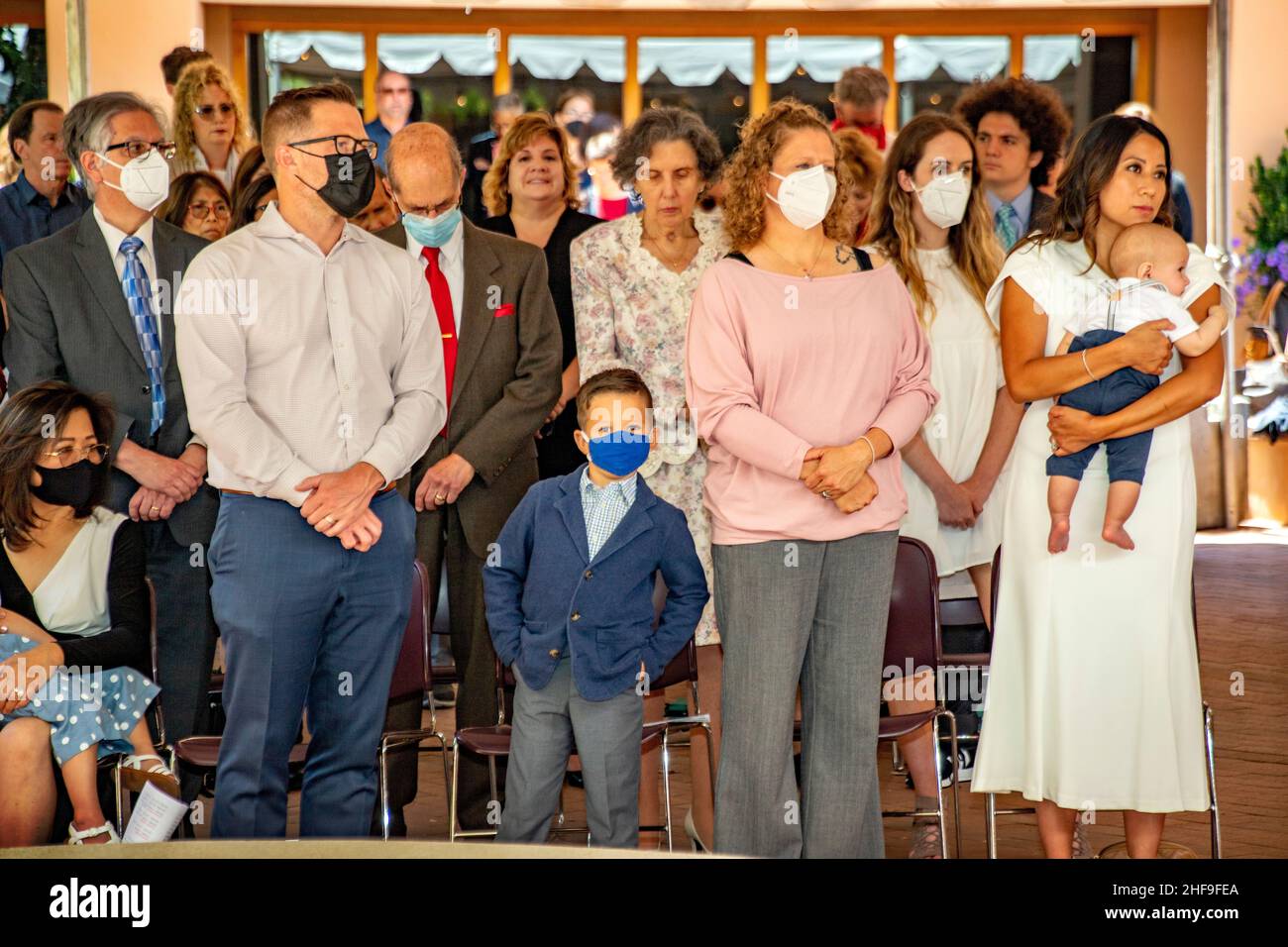 Masked against the coronavirus pandemic, candidates for adult baptism ...