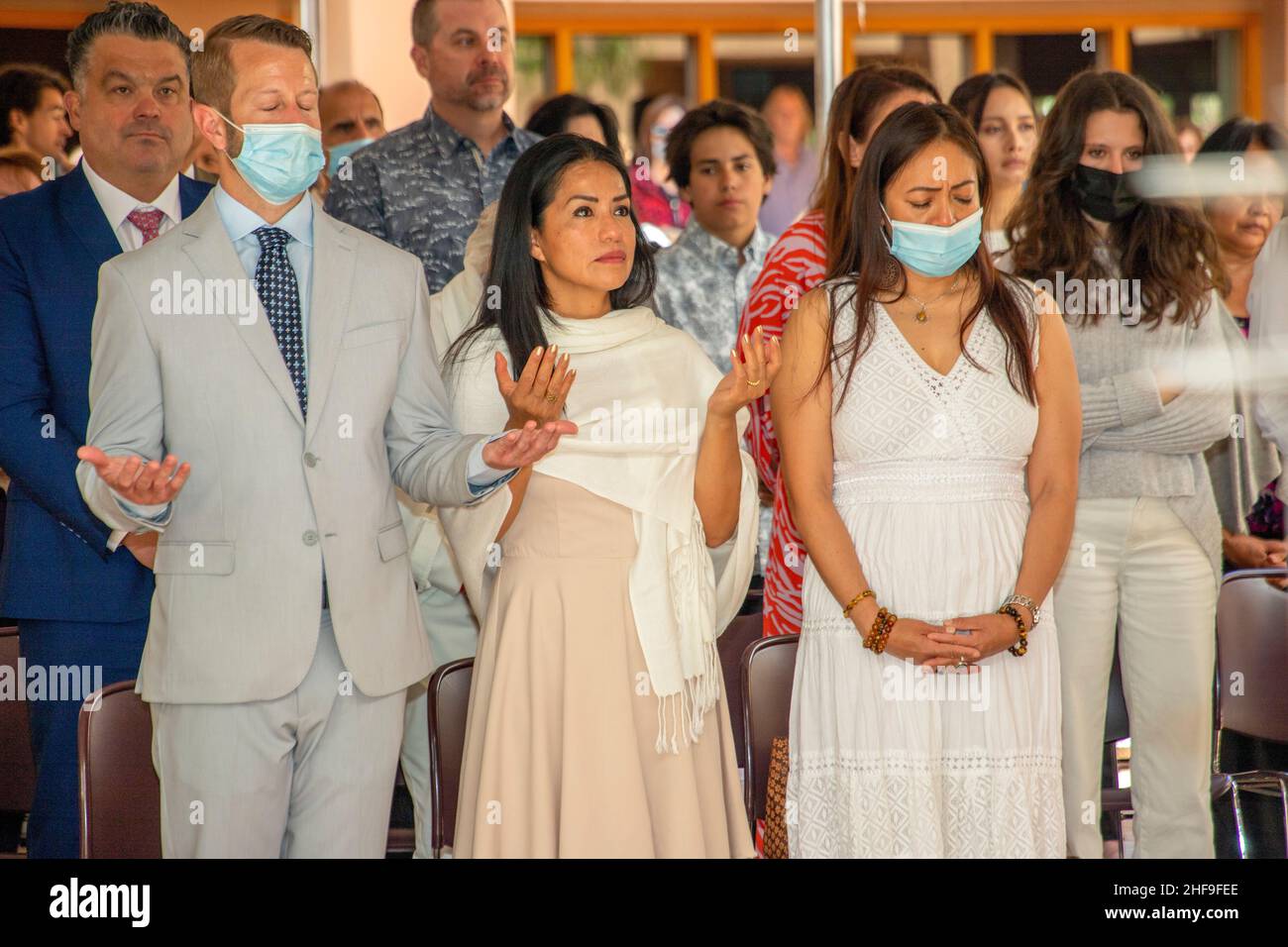 Masked against the coronavirus pandemic, candidates for adult baptism ...
