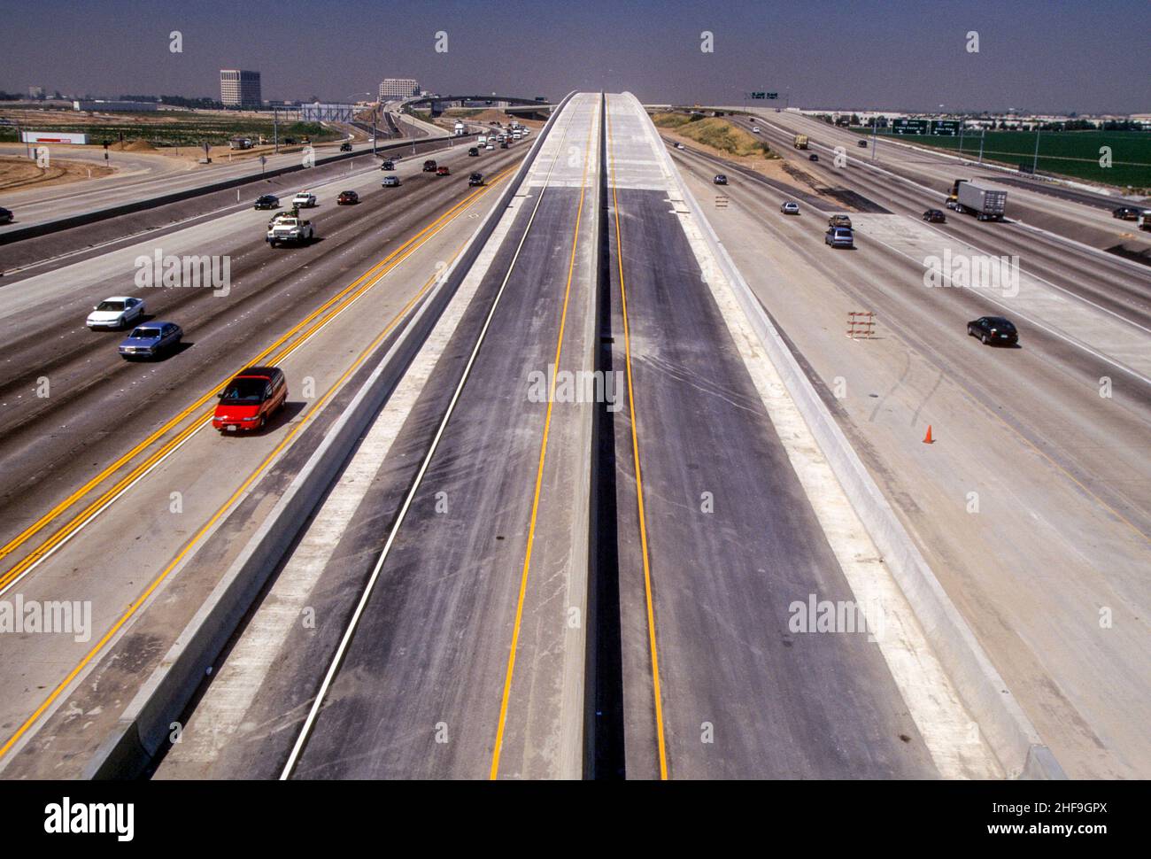 North and Southbound traffic flank a just completed freeway flyover in ...
