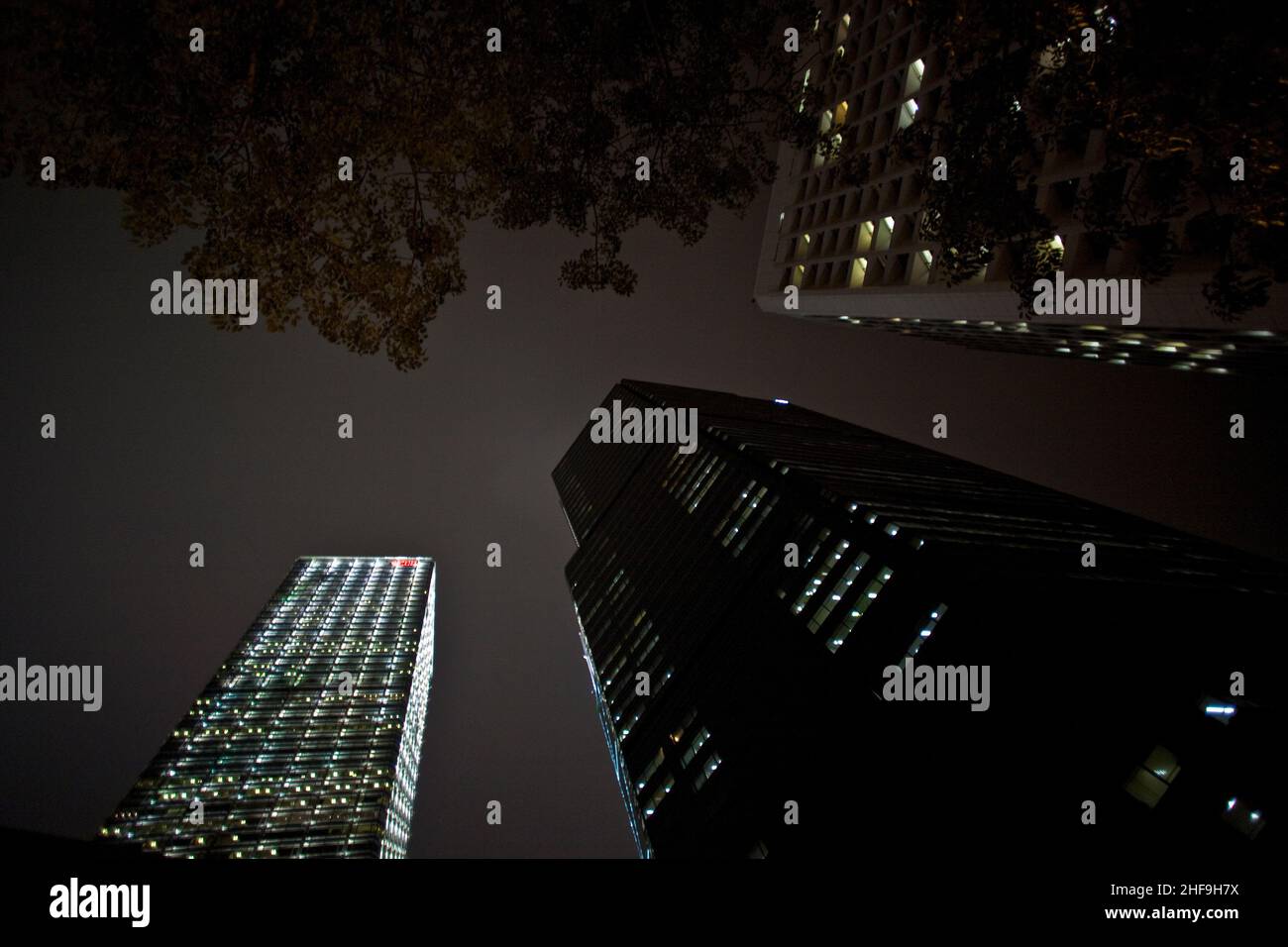 facade of skyscrapers downtown by night Stock Photo - Alamy