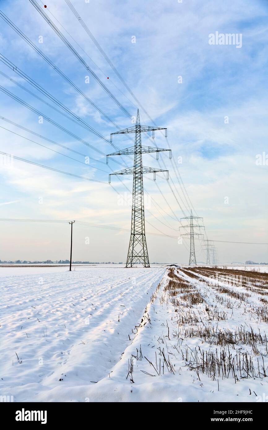 electrical tower in wintertime with snow covered fields Stock Photo - Alamy
