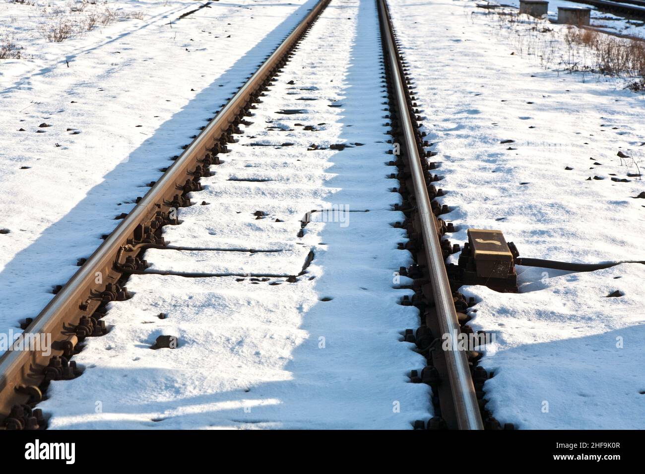 rails in winter at the station Stock Photo - Alamy