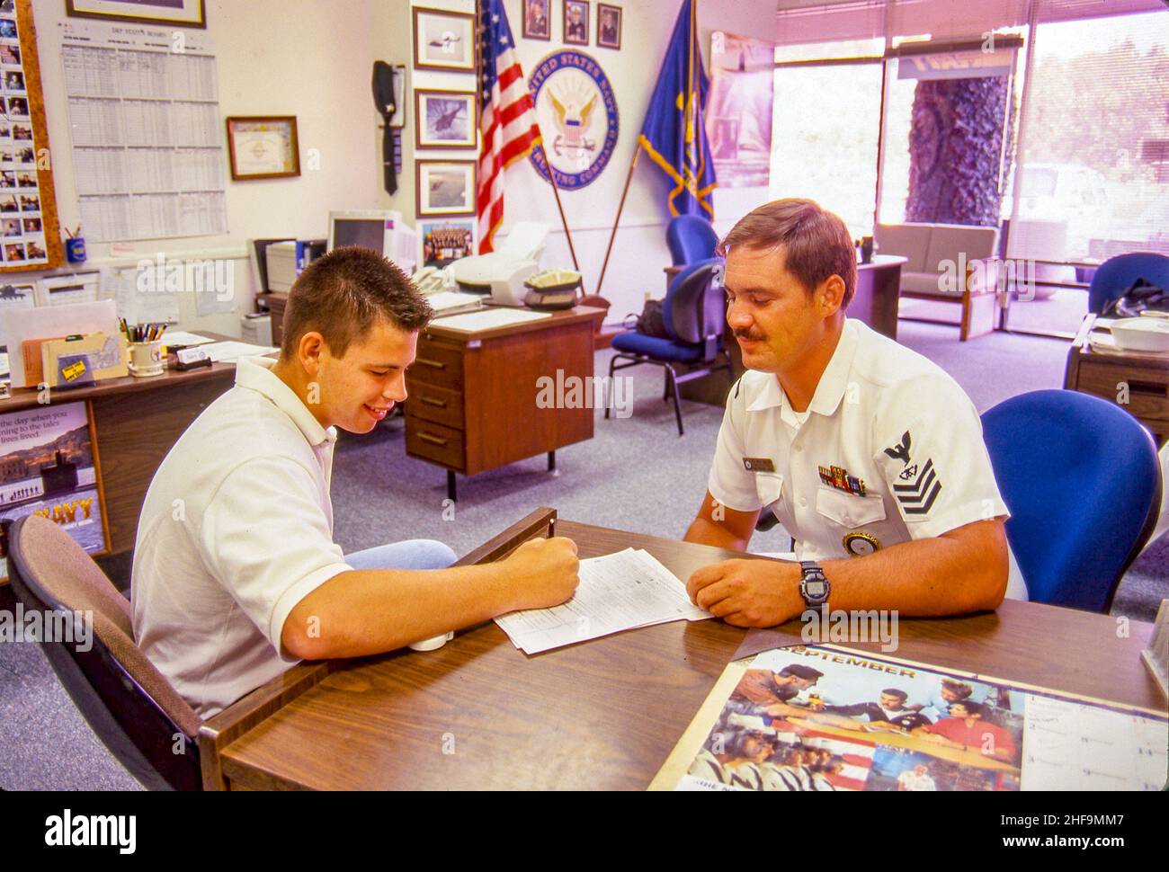 At a recruiting office in Fullerton, CA, a young man signs an ...