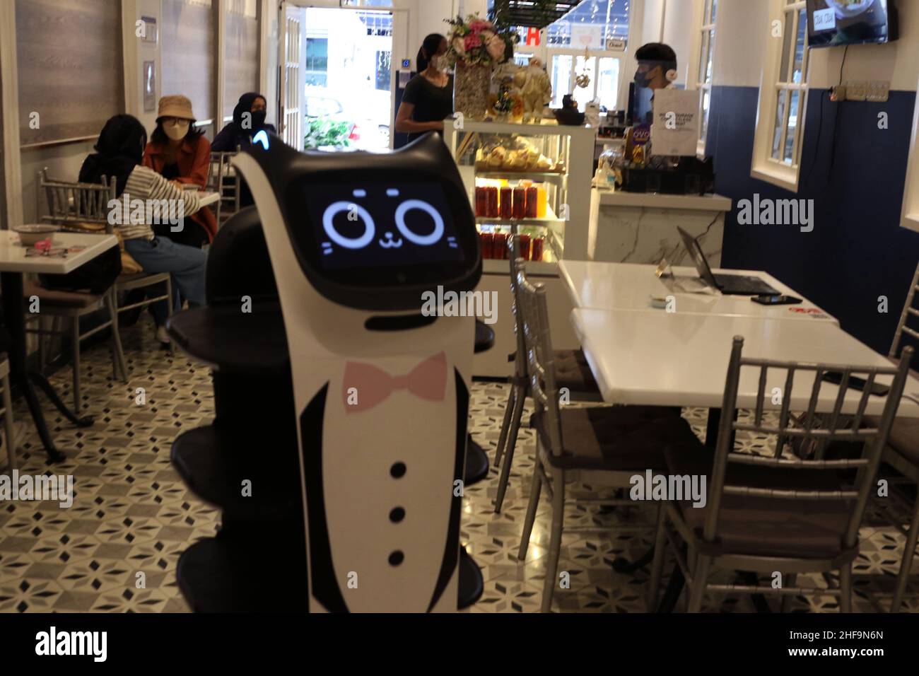 Jakarta, Indonesia. 14th Jan, 2022. Robot waiters serve customers at ...