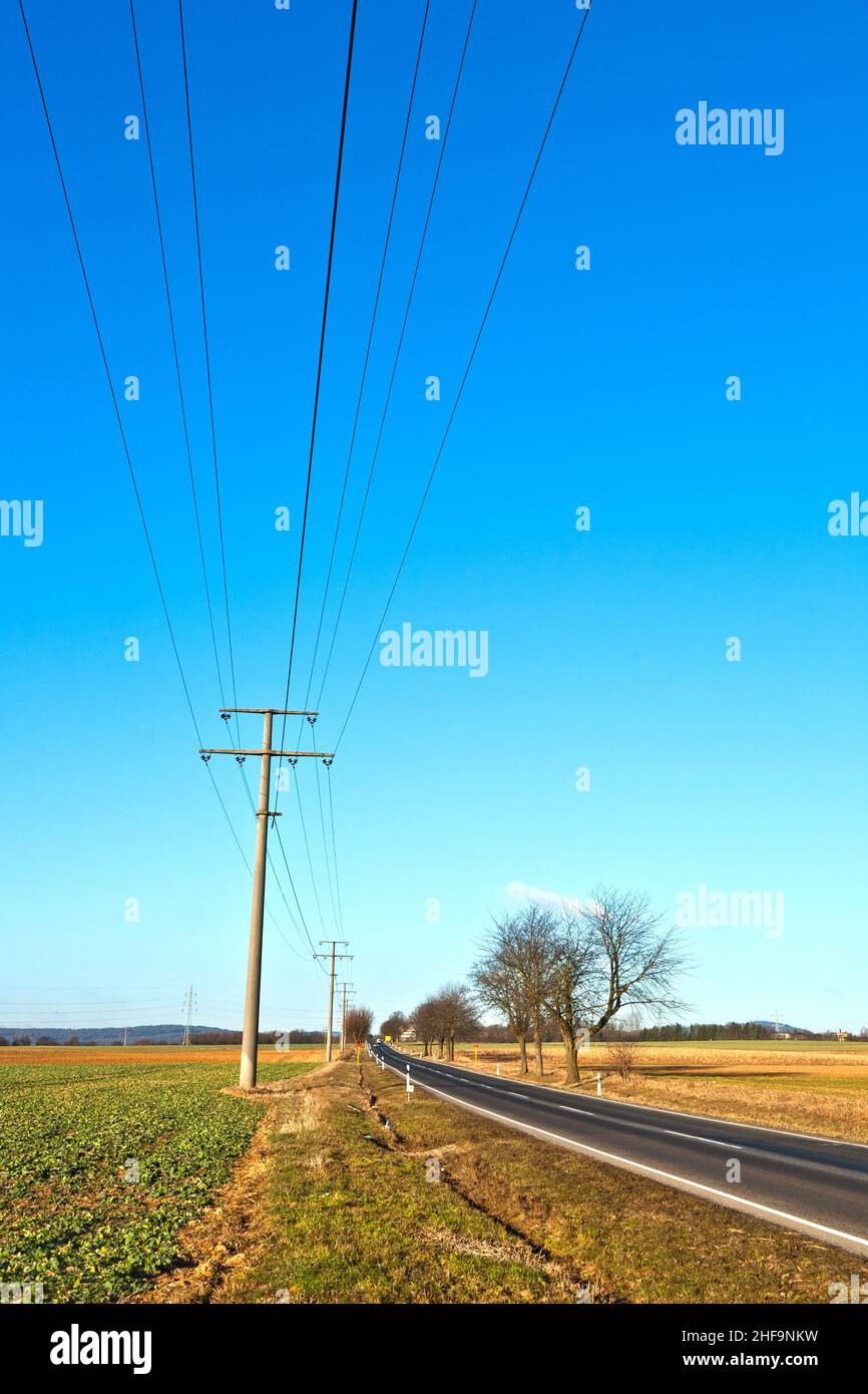 street with electric power lines and trees Stock Photo - Alamy