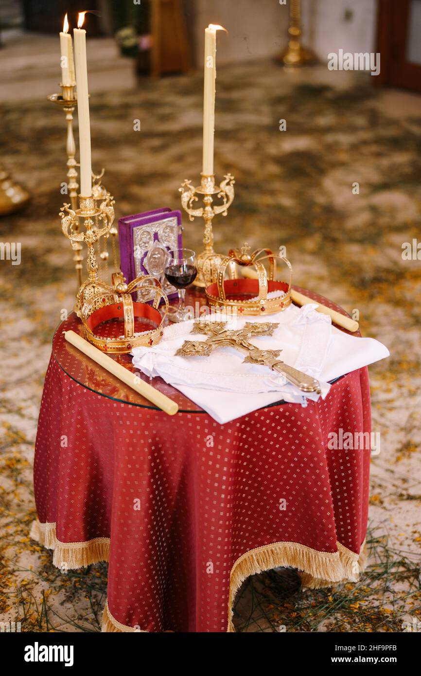 Table with crowns, candles, a crucifix and a bible in the Church of St ...