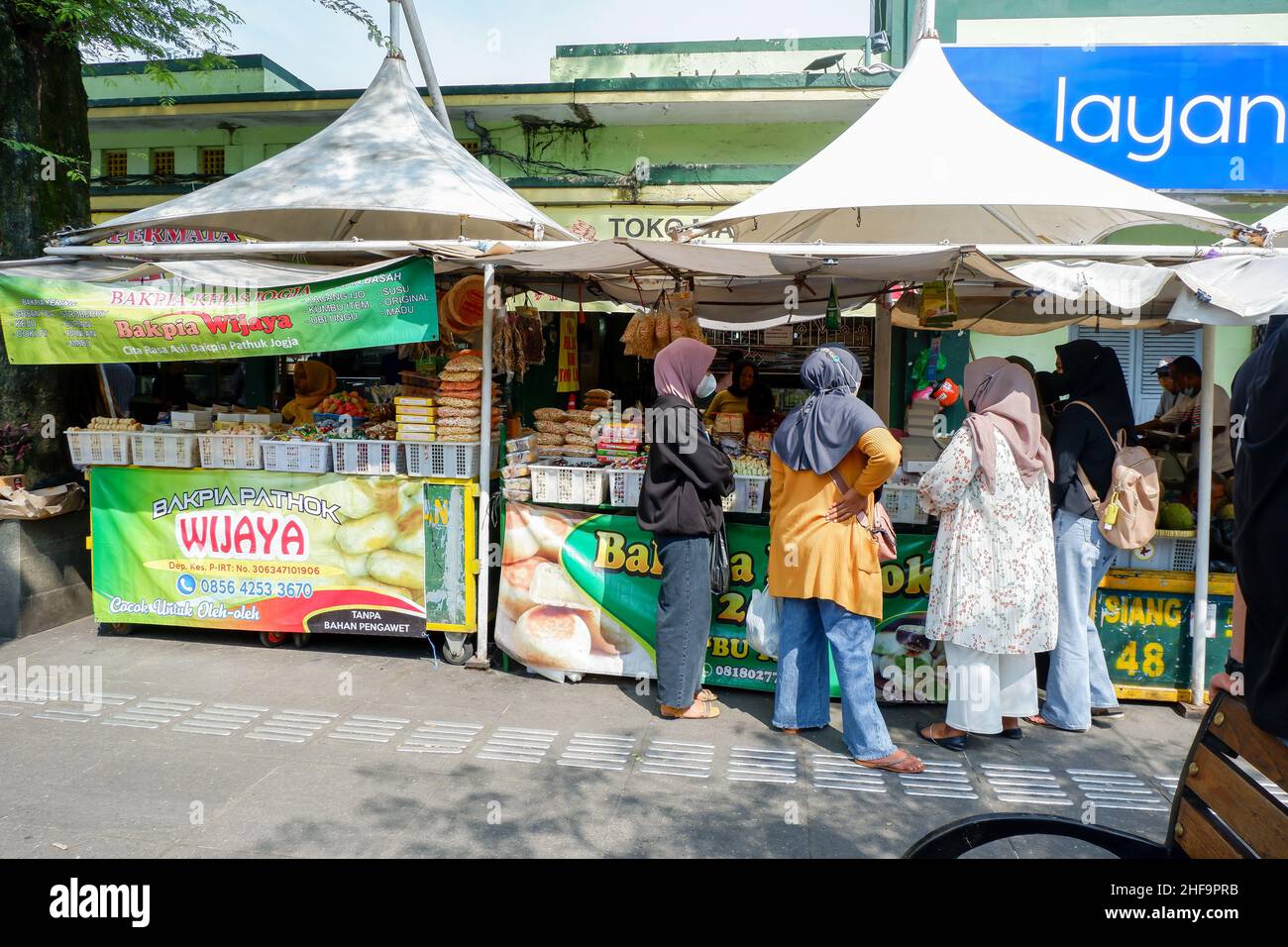 street market in Malioboro selling clothes and food as souvenirs. this ...