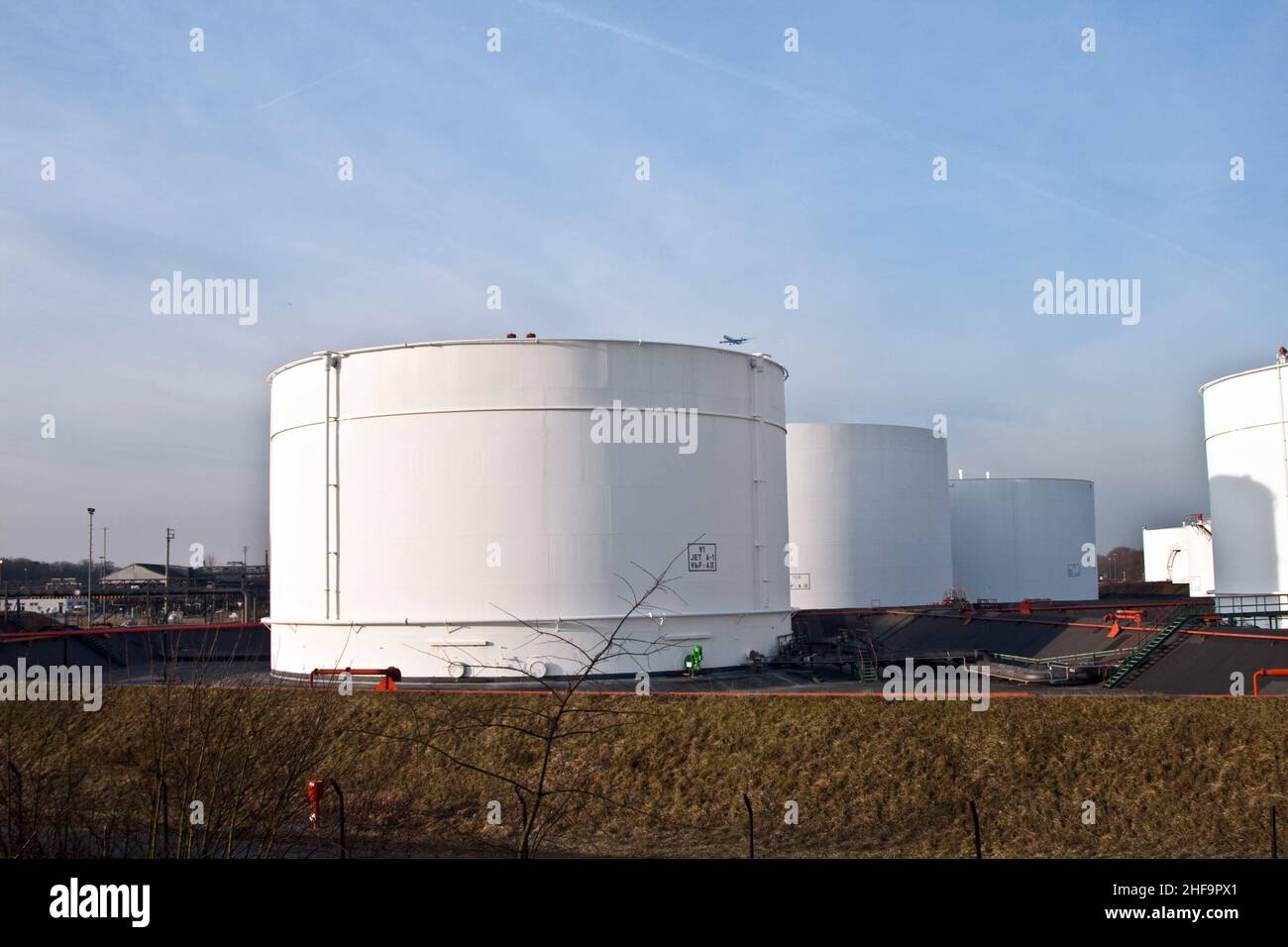 white tanks in tank farm with blue sky Stock Photo - Alamy
