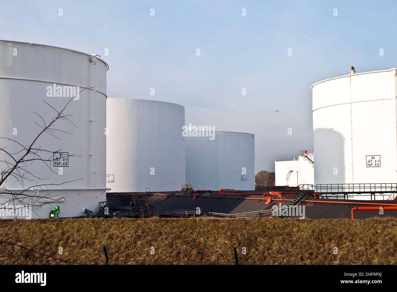 white tanks in tank farm with blue sky Stock Photo - Alamy