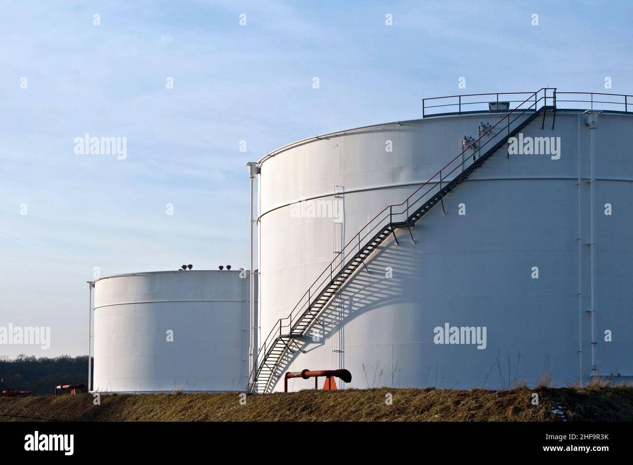 industrial stair at white tank in tank farm Stock Photo - Alamy