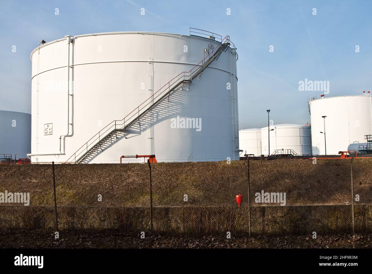 industrial stair at white tank in tank farm Stock Photo - Alamy