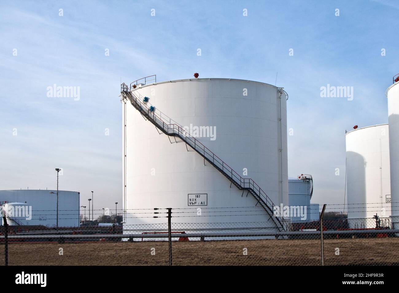 industrial stair at white tank in tank farm Stock Photo - Alamy