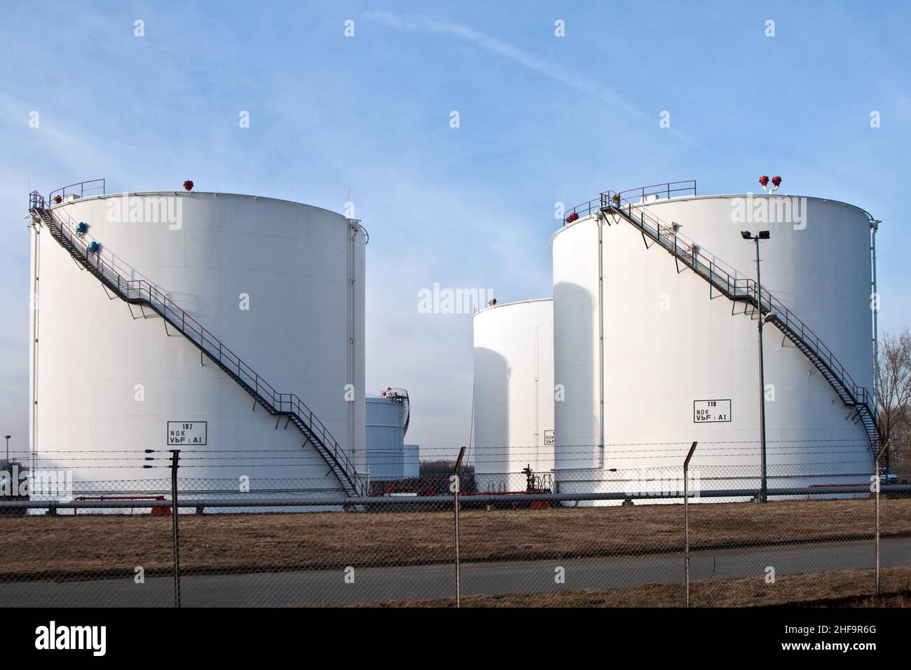 industrial stair at white tank in tank farm Stock Photo - Alamy