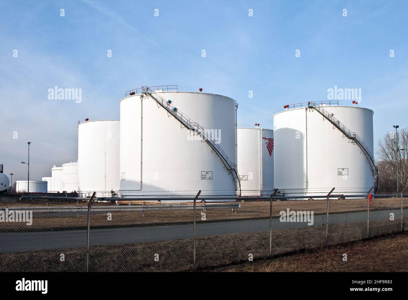 white tanks in tank farm with blue sky Stock Photo - Alamy