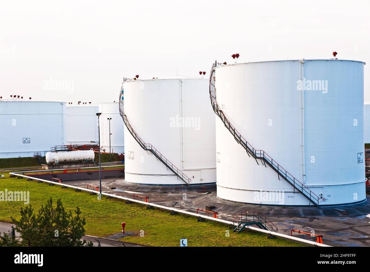 white tanks for petrol and oil in tank farm with blue sky Stock Photo ...