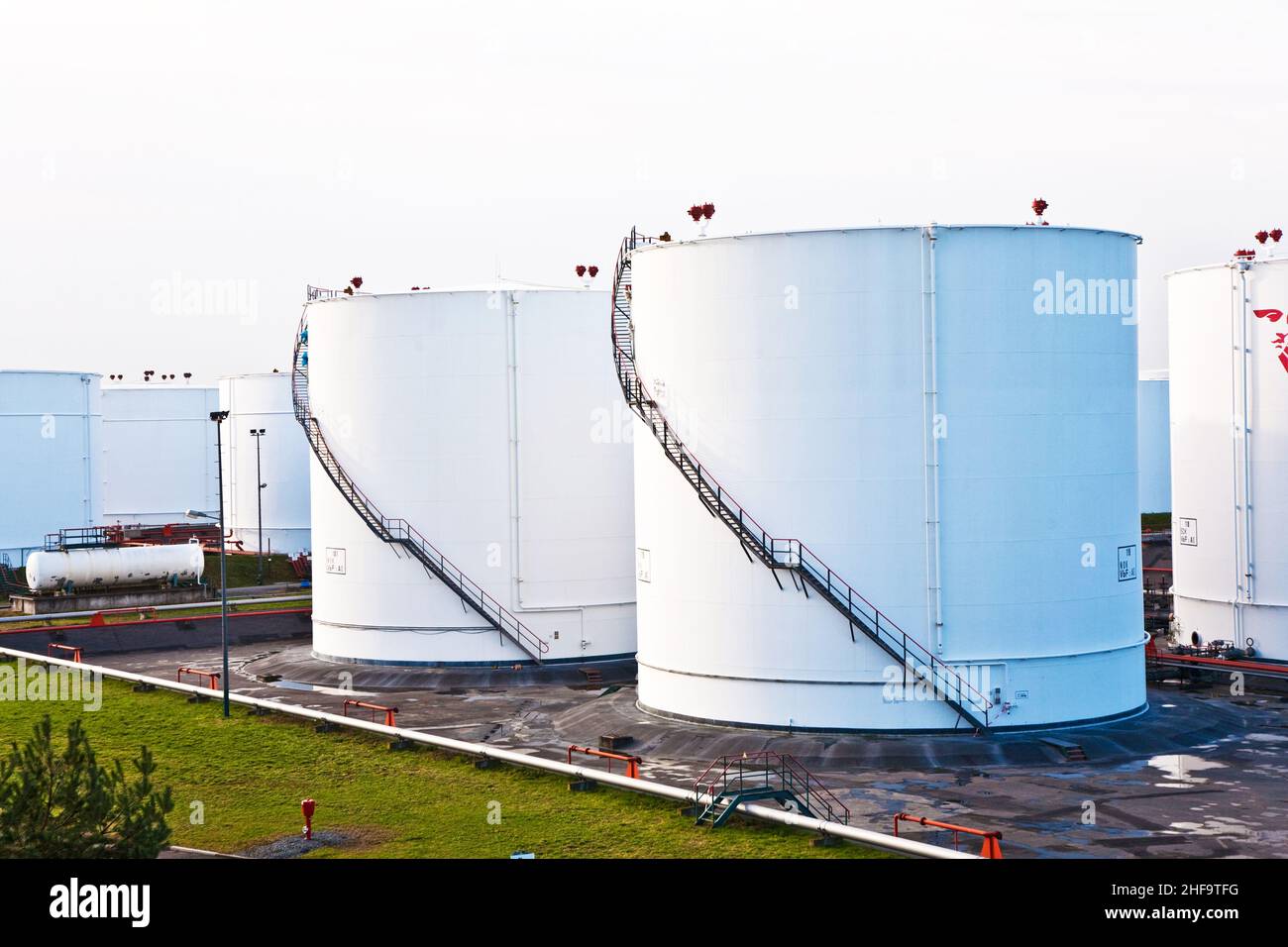 white tanks for petrol and oil in tank farm with blue sky Stock Photo ...