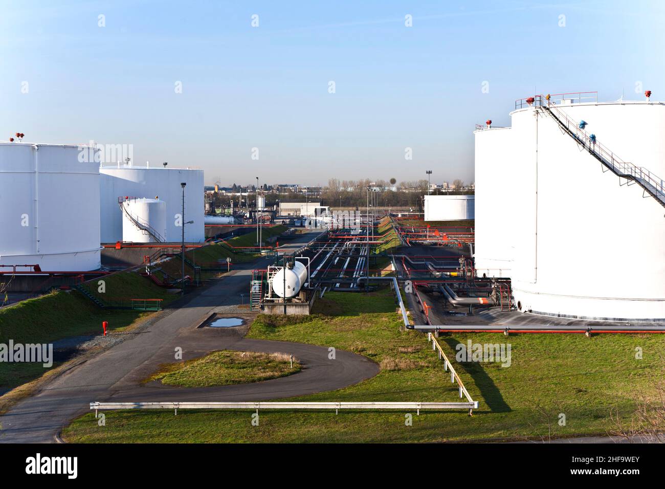white tanks in tank farm with blue clear sky Stock Photo - Alamy