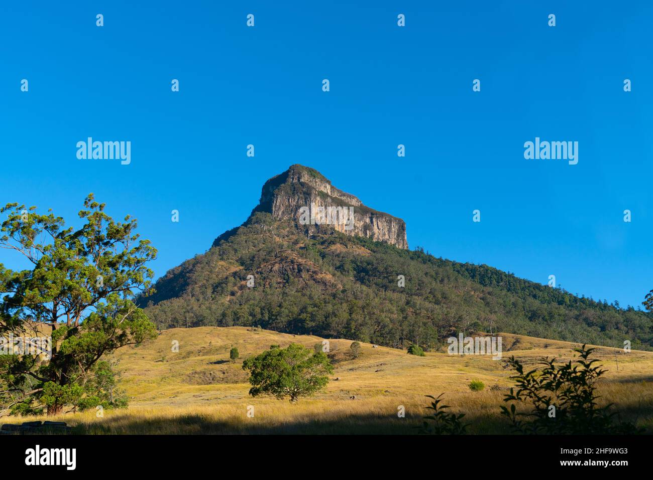 Huge sheer faced rock in Queensland landscape, Australia Stock Photo ...