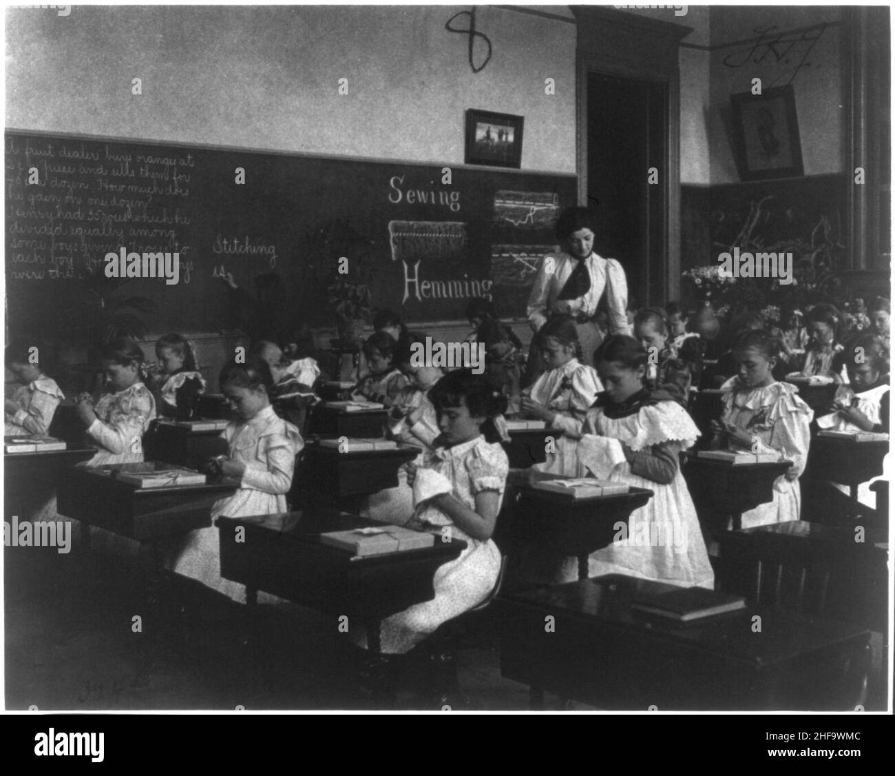 School girls in sewing class Stock Photo - Alamy
