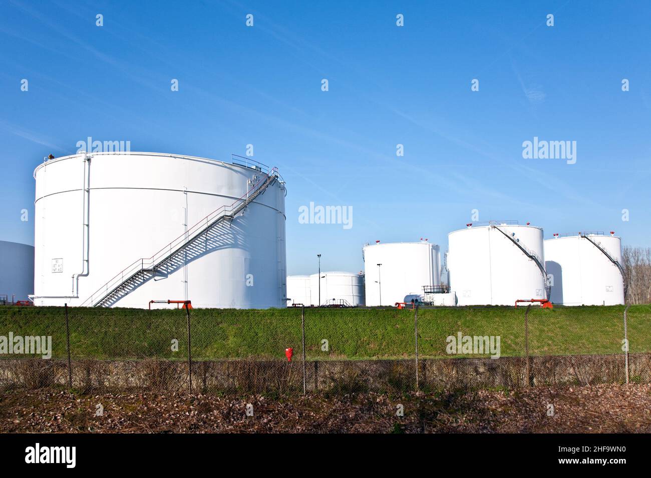 white tanks in tank farm with blue clear sky Stock Photo - Alamy