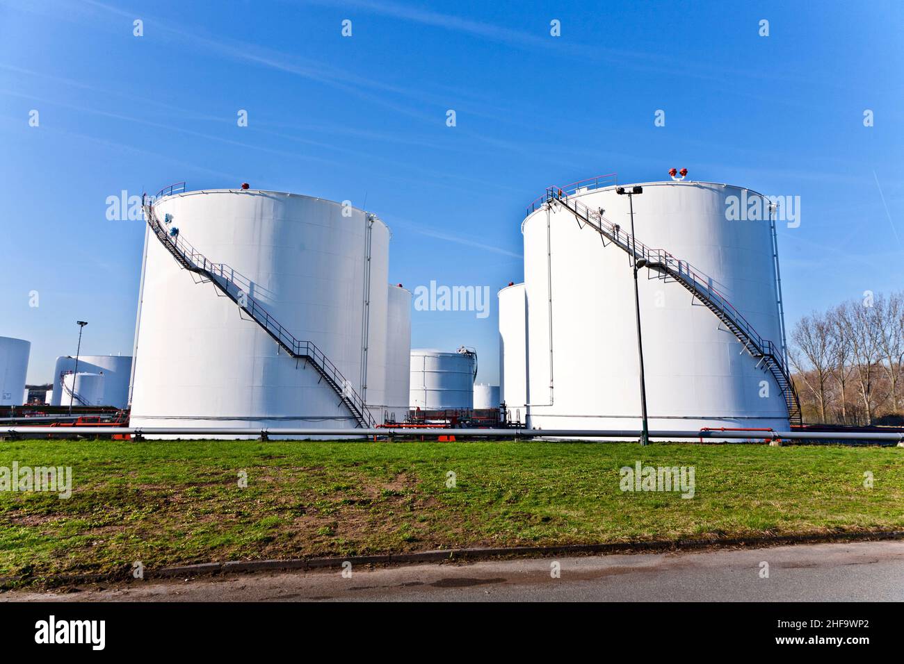 white tanks in tank farm with blue clear sky Stock Photo - Alamy
