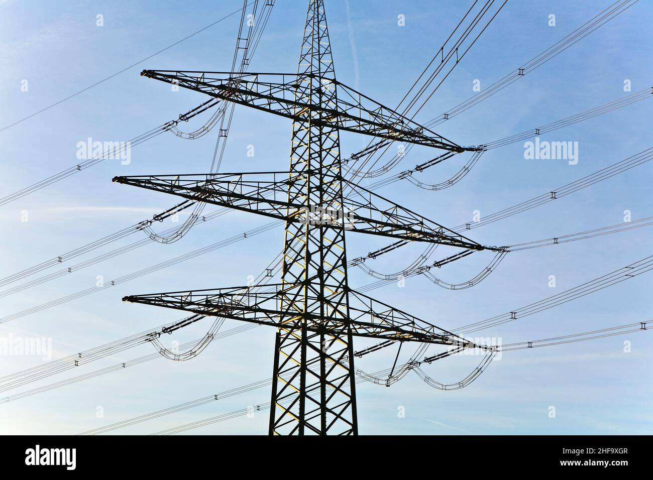 electrical pylon under blue sky, power line cable Stock Photo - Alamy