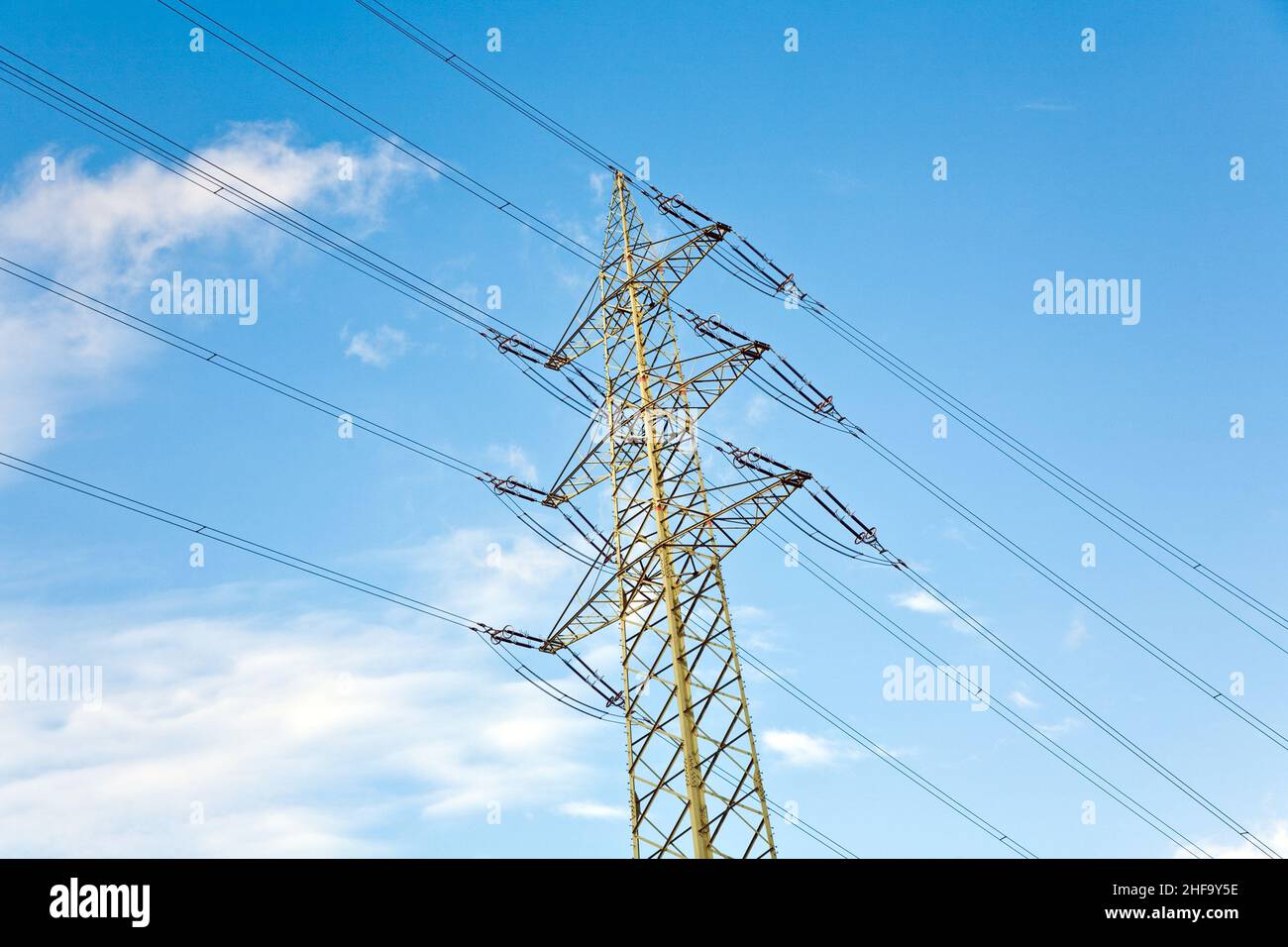 electrical pylon under blue sky, power line cable Stock Photo - Alamy